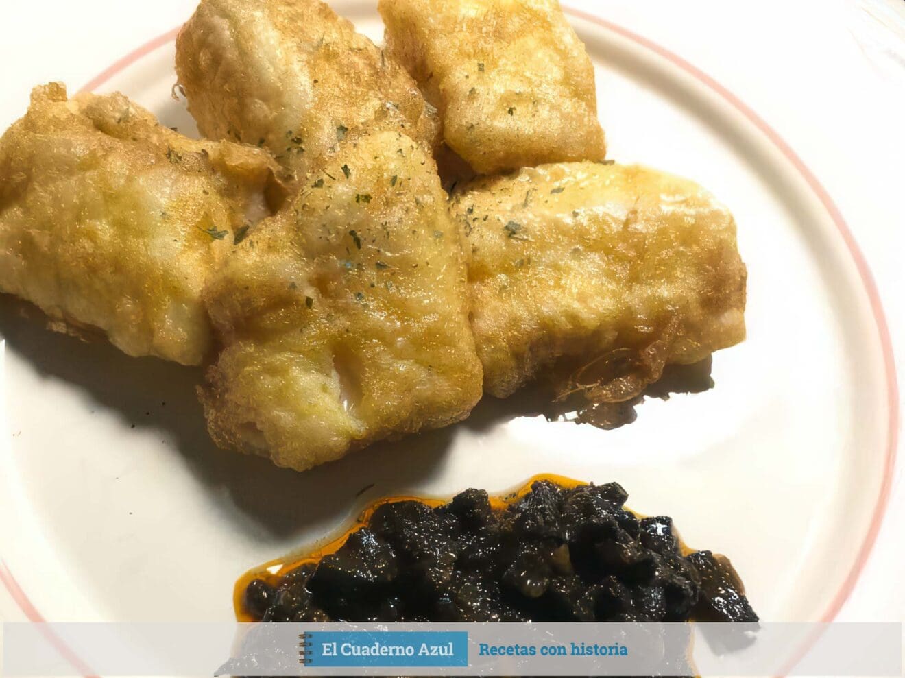 Merluza rebozada con calamares en su tinta: una combinación clásica y ...